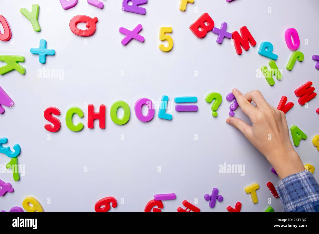 Colorful letters on blackboard. Kids hand writing words, school year ...