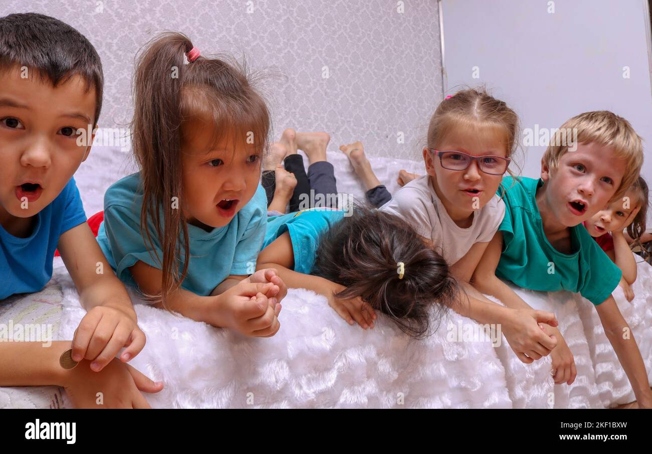 siblings lying on sofa at home, singing together Stock Photo - Alamy
