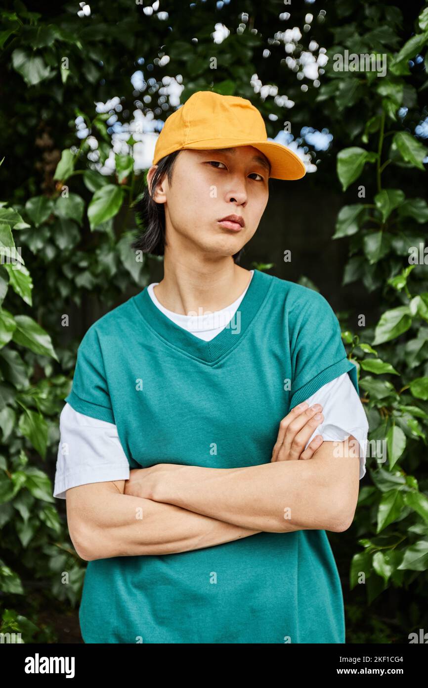 Portrait of young Asian man wearing colorful casual wear posing ...