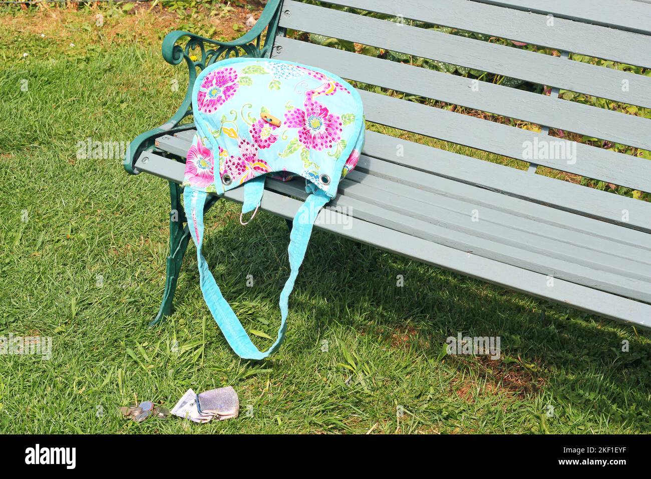 Handbag with contents spilt onto the floor, dumped after being stolen ...