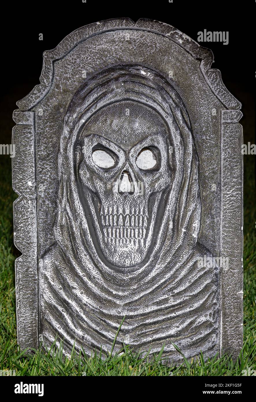 Halloween Hooded Skeleton Tombstone Decorating Yard at Night Stock ...