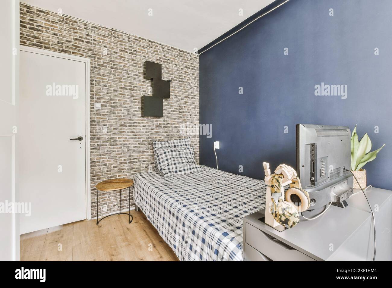 Home interior design of bedroom with bed and wooden wardrobe placed in ...