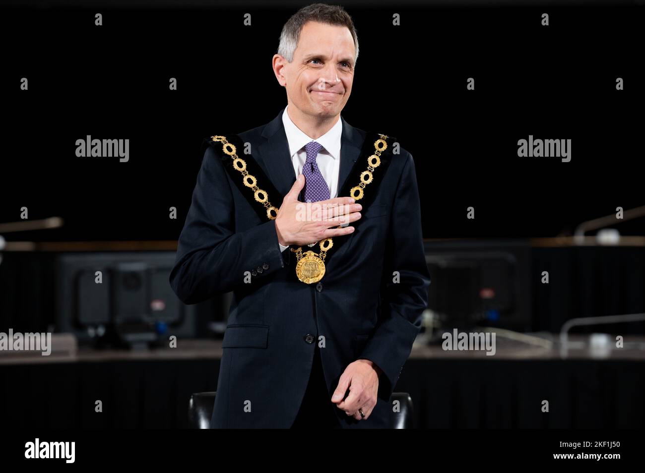 Ottawa Mayor Mark Sutcliffe places his hand on his chest after ...