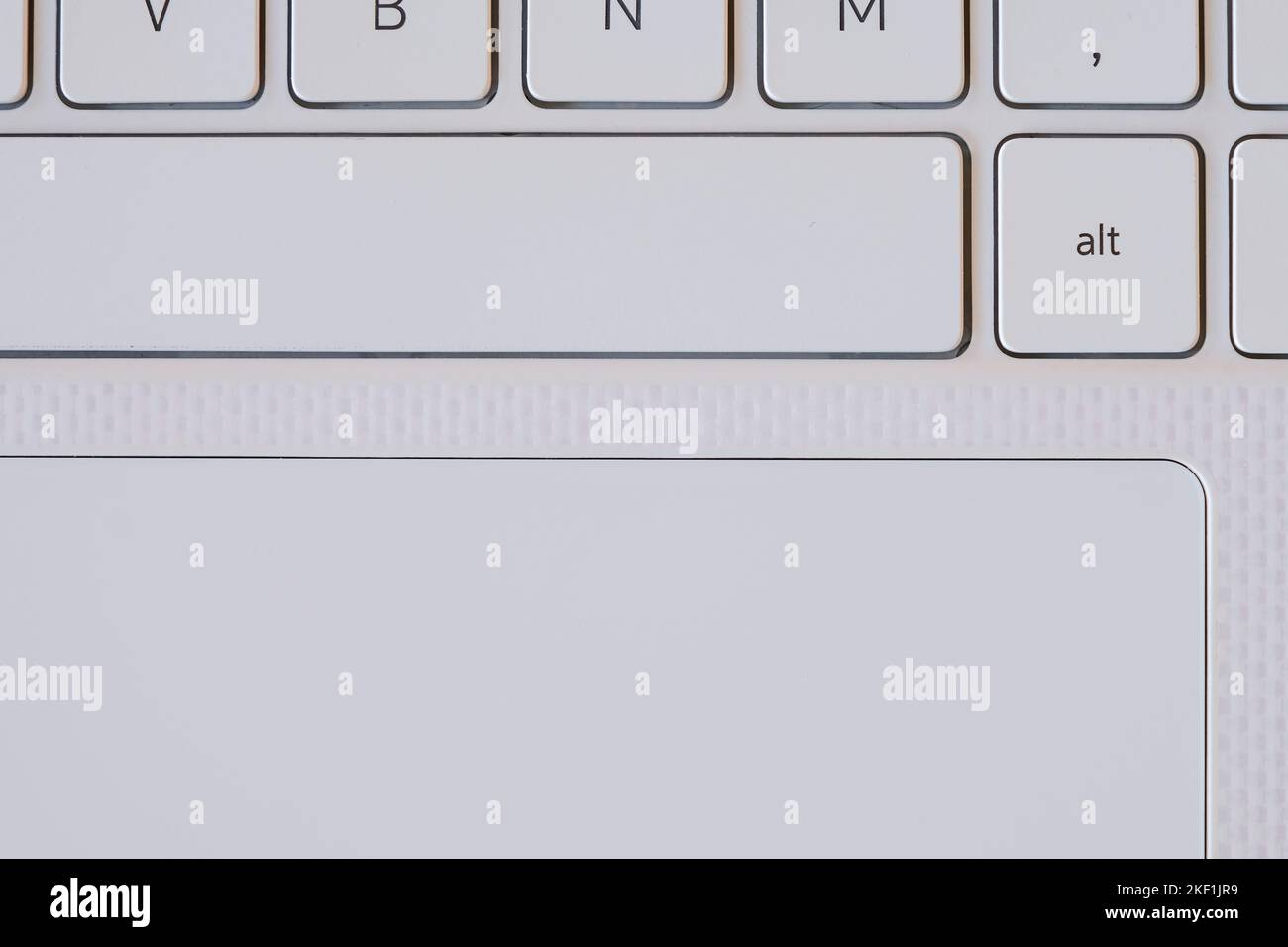 Partial overhead white laptop keyboard and trackpad Stock Photo - Alamy