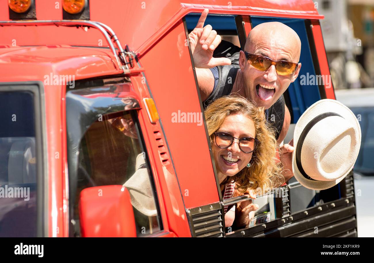 Happy couple of tourist travelers around Patong with tuk-tuk taxi car ...