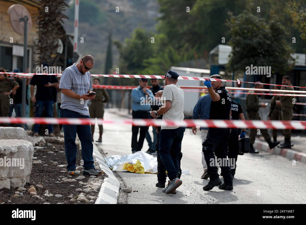 Ariel. 15th Nov, 2022. People gather at the scene of an attack near the ...