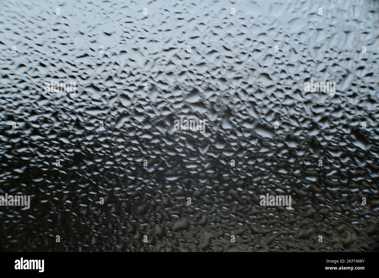 large drops of dew on the window after condensation on the window ...