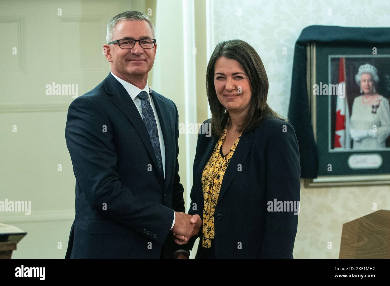 Travis Toews shakes hands with Alberta Premier Danielle Smith after ...