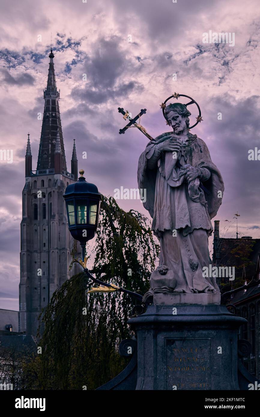 A vertical shot of the statue of Saint John of Nepomuk. Bruges, Belgium ...
