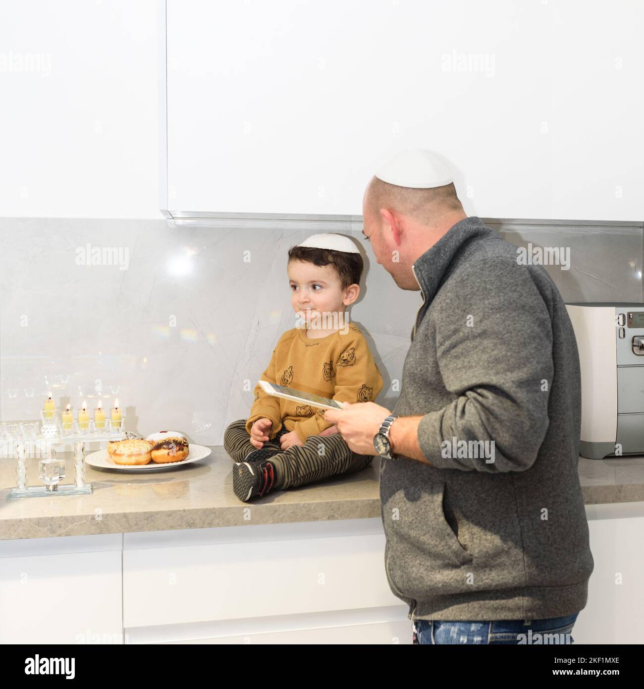 Father and son celebrating Hanukkah Israel holiday. Little Jewish boy ...