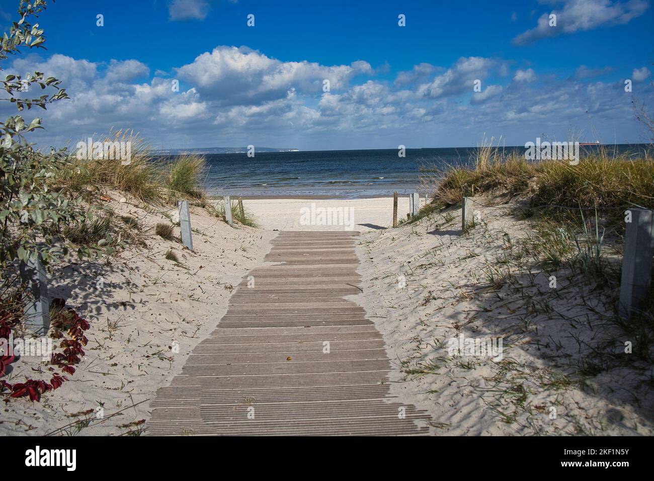 A wooden footpath leading to the beach in Rugia Island, Germany Stock ...