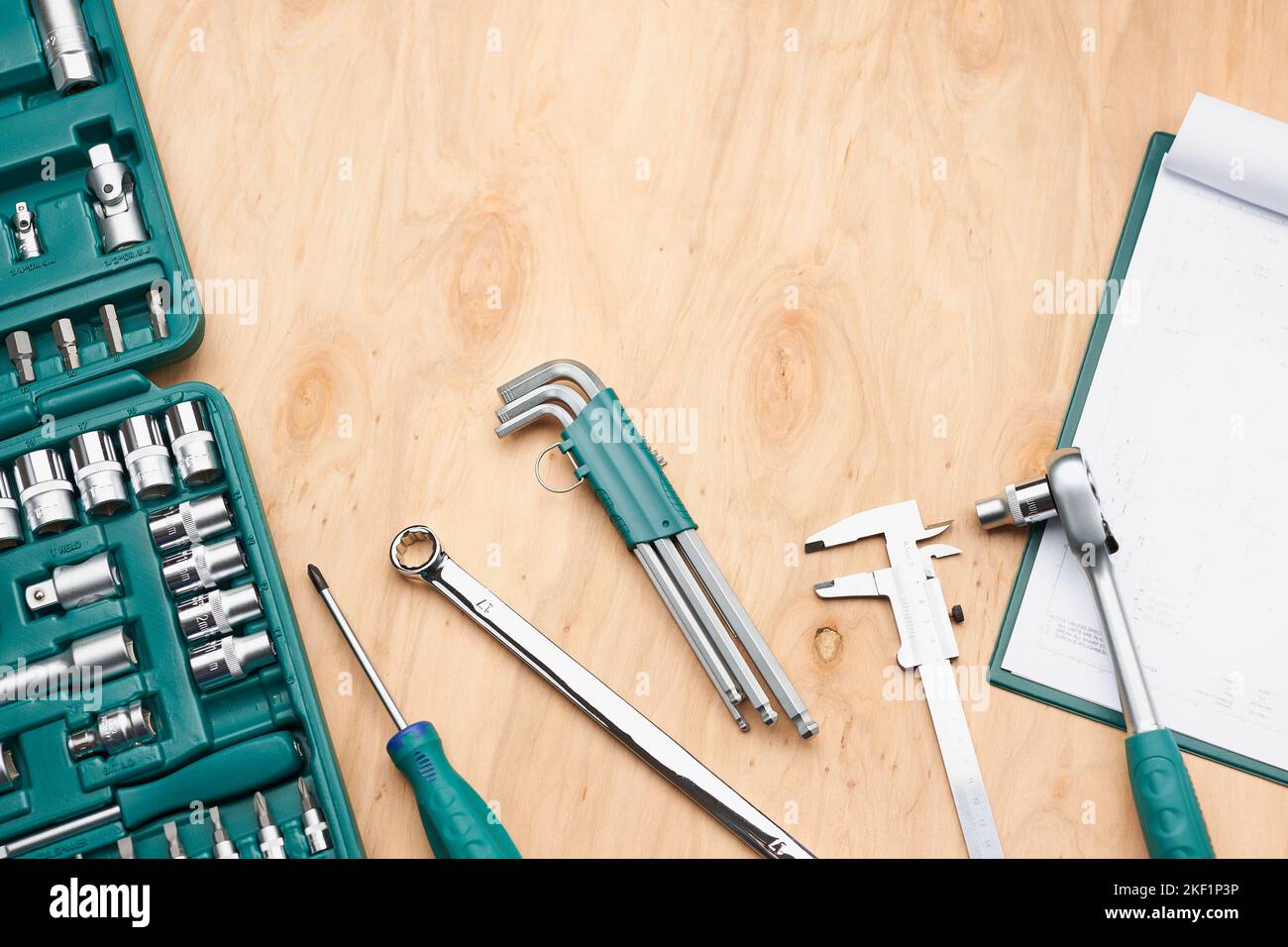 Workshop table with many tools. Wrench, spanner, calliper and ratchet ...
