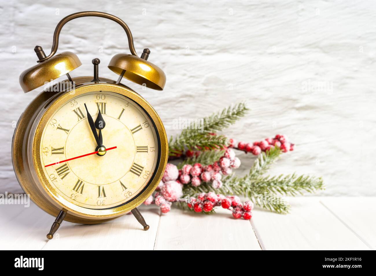 Decorative Christmas tree and bronze alarm clock countdown to midnight ...