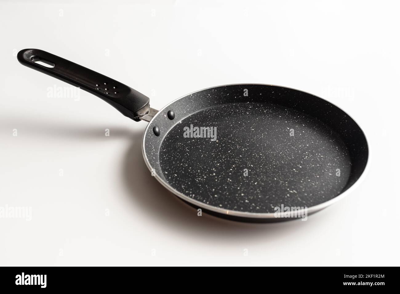 Empty pan for pancake on white background Stock Photo - Alamy