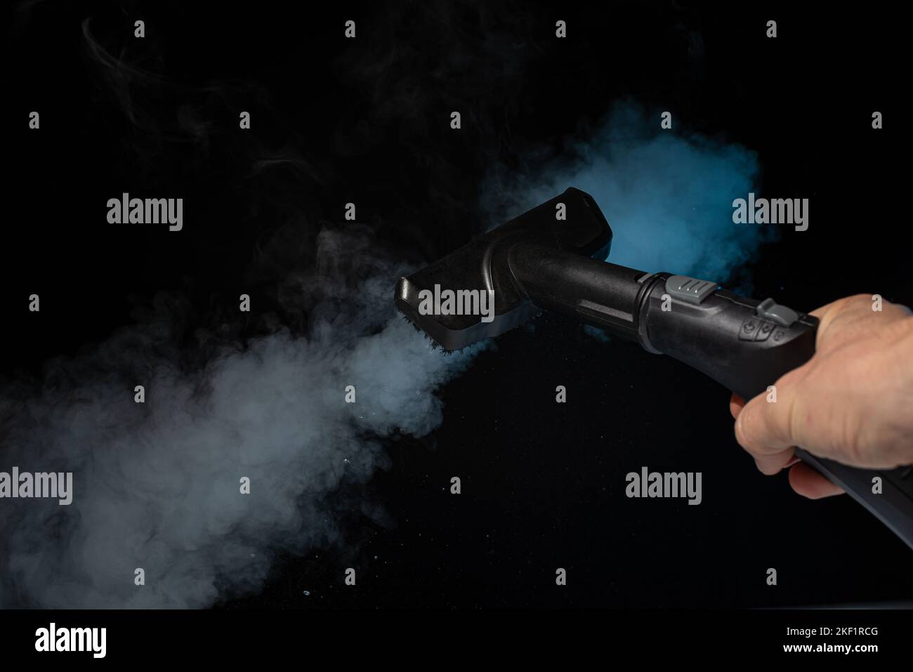Steam clean cleaning at home. Steam on black background Stock Photo - Alamy