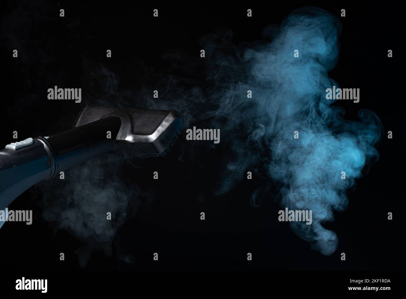 steam cleaning concept. steam on black background Stock Photo - Alamy
