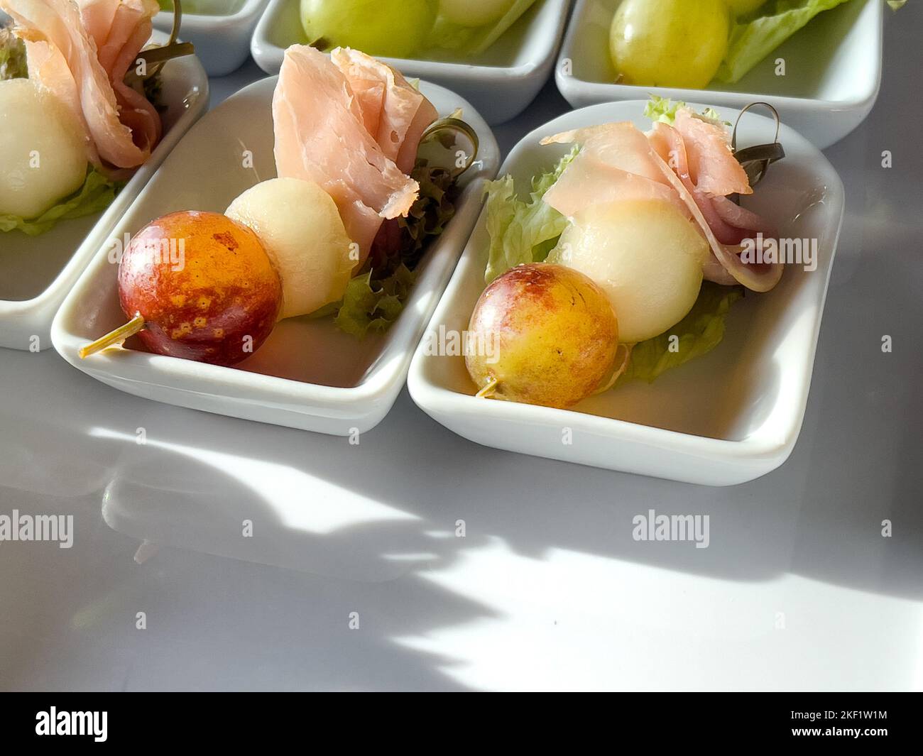 canapes of grapes, cheese and mozzarella, on a plate Stock Photo - Alamy