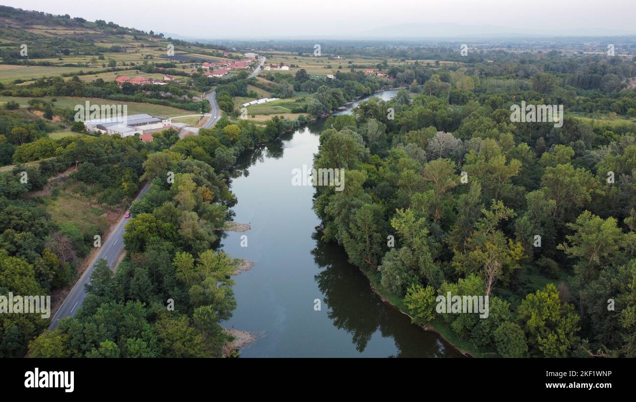 An aerial view of a deep river surrounded by dense forests Stock Photo ...