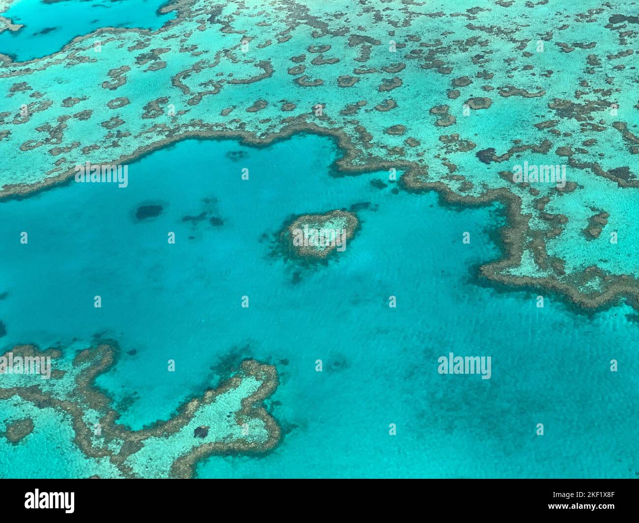 An aerial view of a heart-shaped reef in Whitsunday Islands, Australia ...