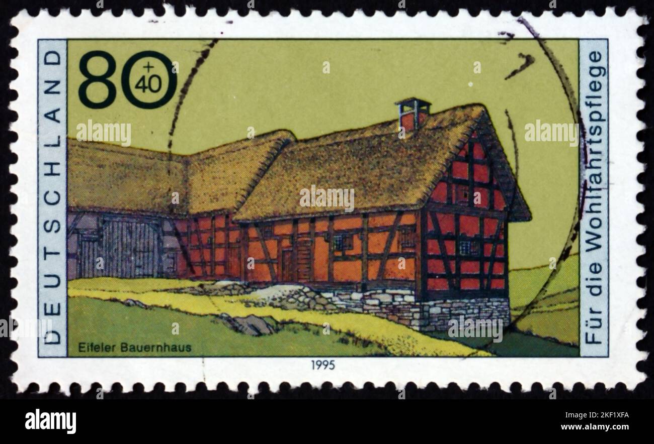 GERMANY - CIRCA 1995: a stamp printed in Germany shows Farmhouse, Eifel ...