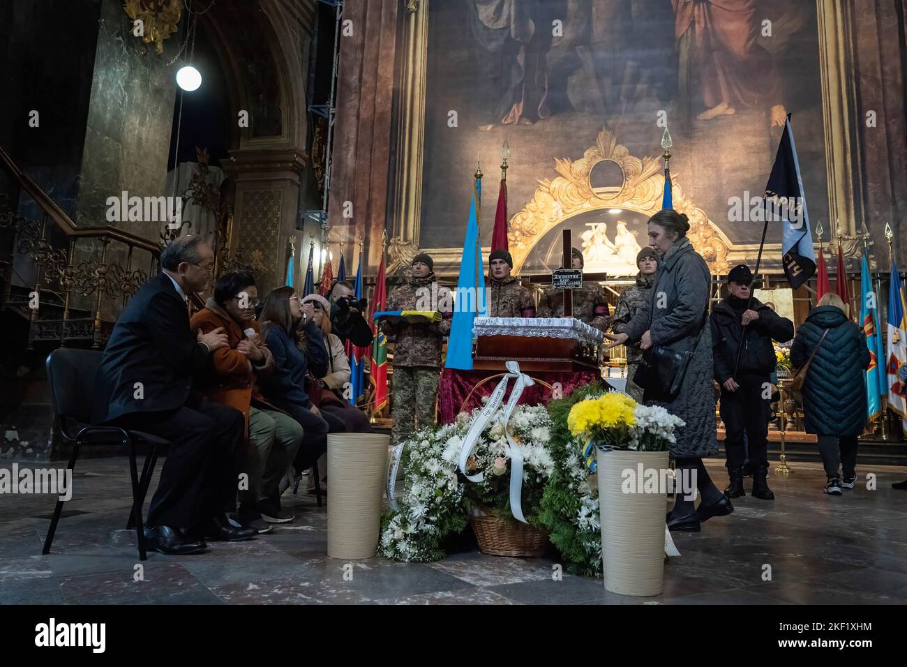 Lviv, Ukraine. 14th Nov, 2022. A woman seen paying tribute to the body ...