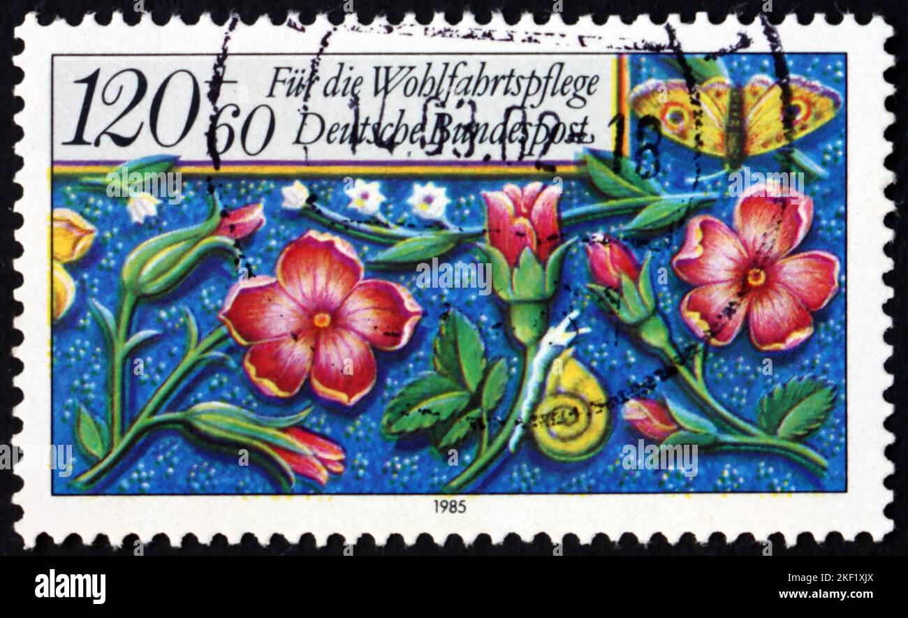 GERMANY - CIRCA 1985: a stamp printed in Germany shows Flowers, Snail ...