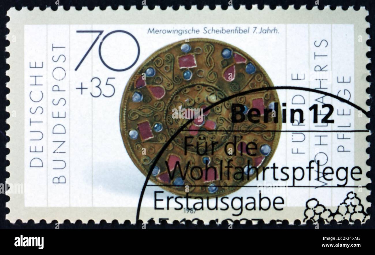 GERMANY - CIRCA 1987: a stamp printed in Germany shows Merovingian disk ...
