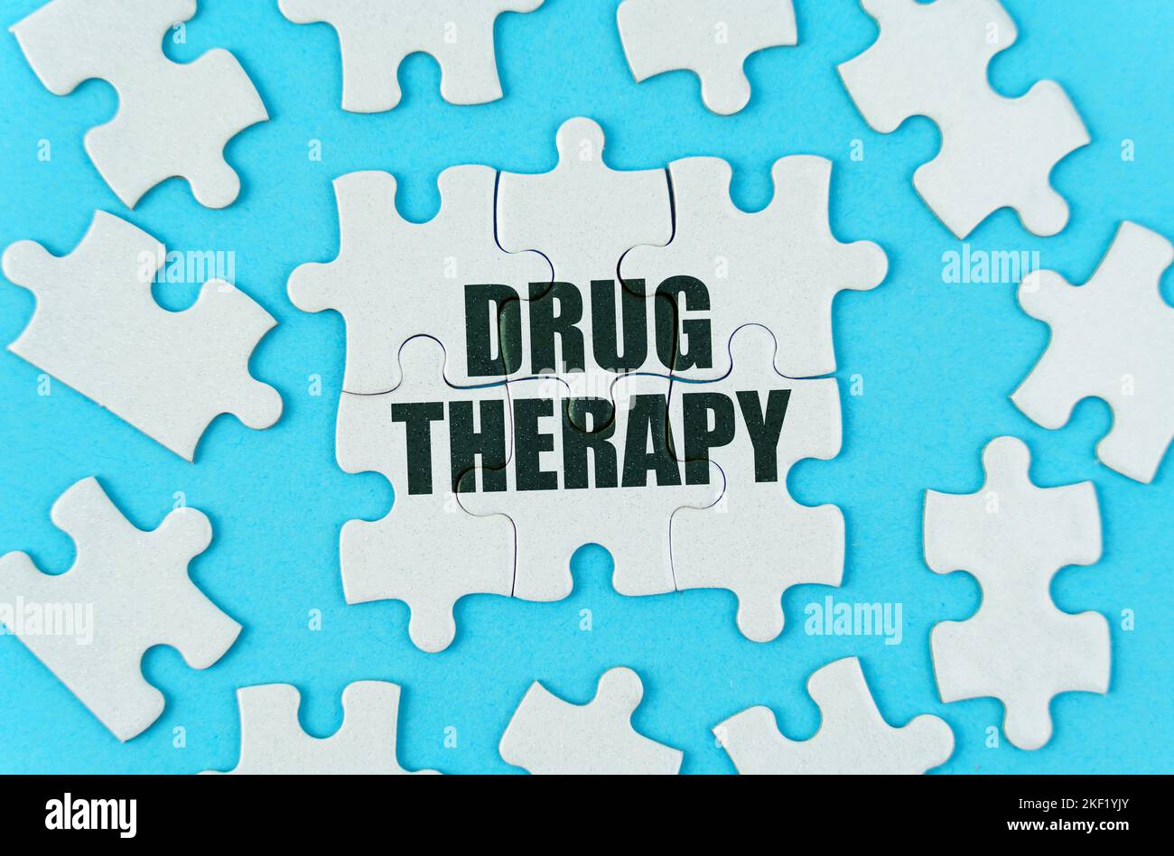 Medical concept. On a blue background are white puzzles with the ...
