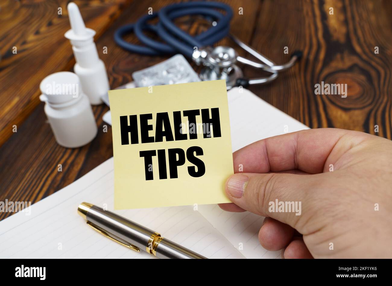 Medical concept. On the table is a notebook, medicines and a ...