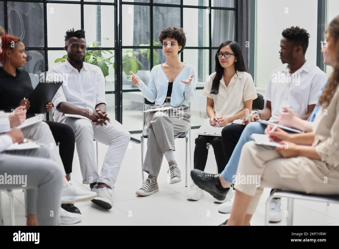 Business lecture. Happy executives , listening his speech in boardroom ...