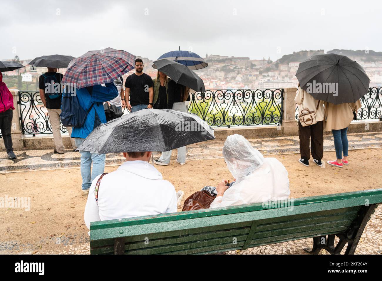 Heavy rain sweeps in and tourists have to take shelter as they take ...