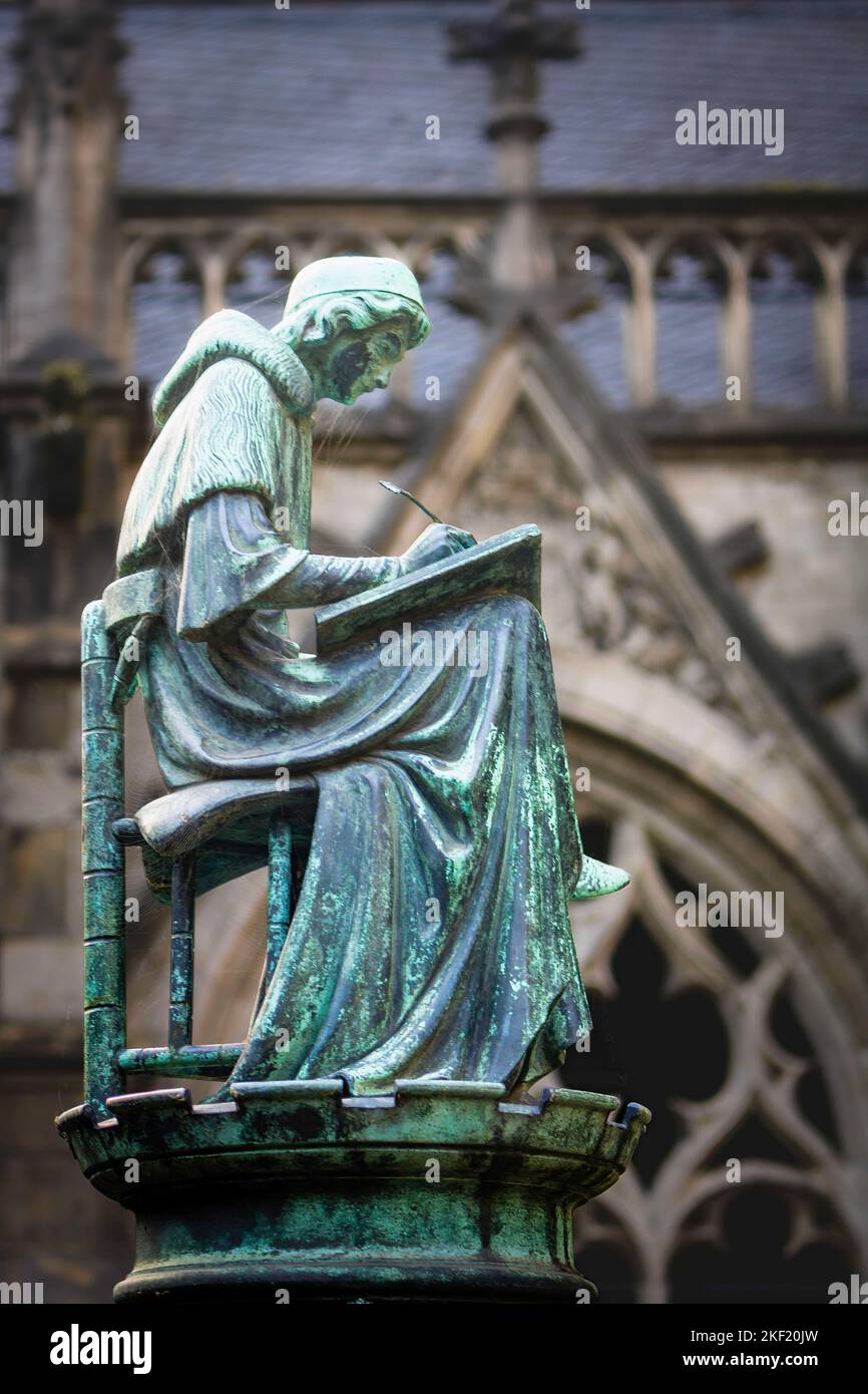 Statue of a writing monk at the medieval Dom cathedral, Utrecht, the ...