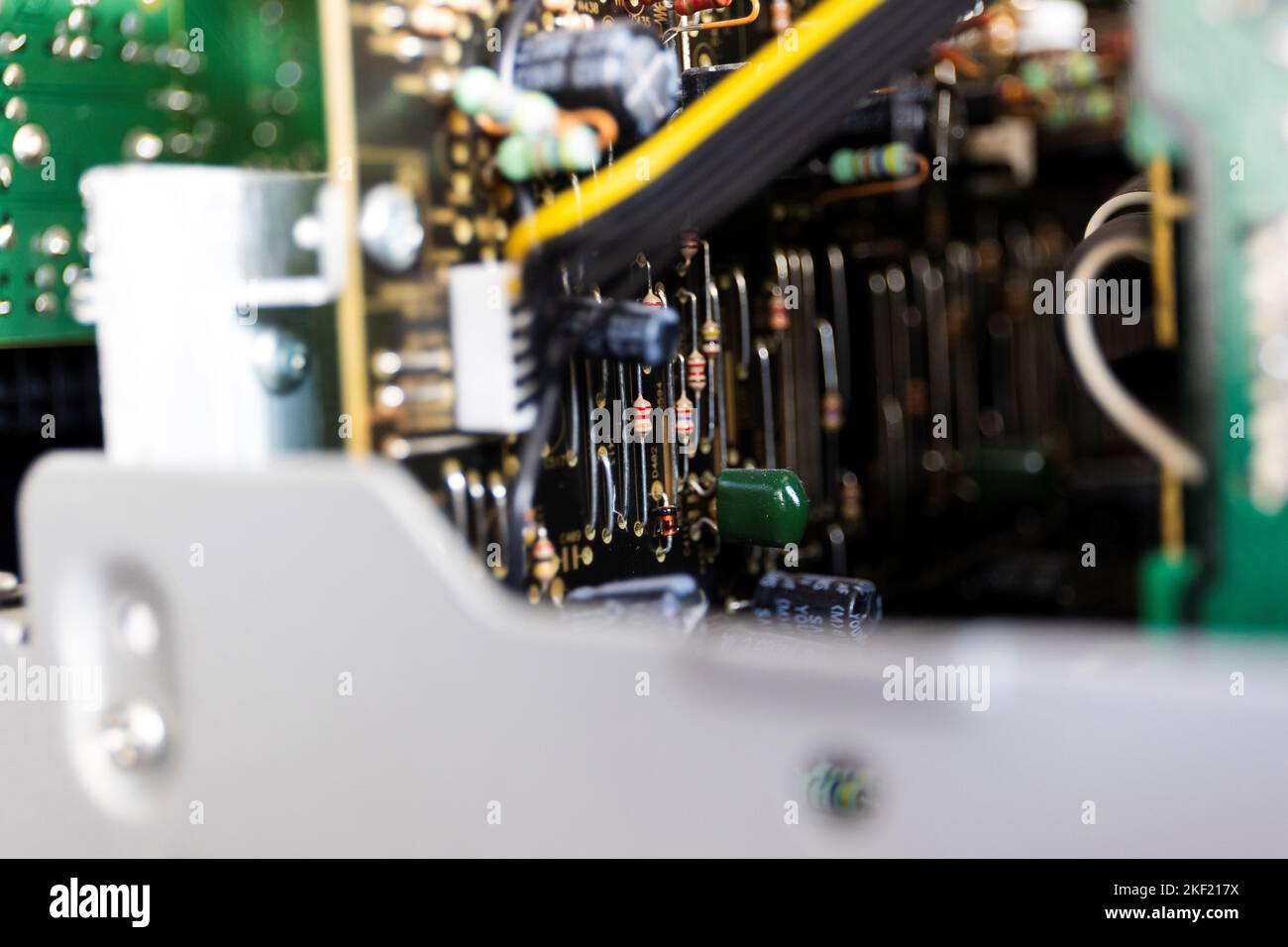 A close up portrait focused on a bunch of resistors on a black ...