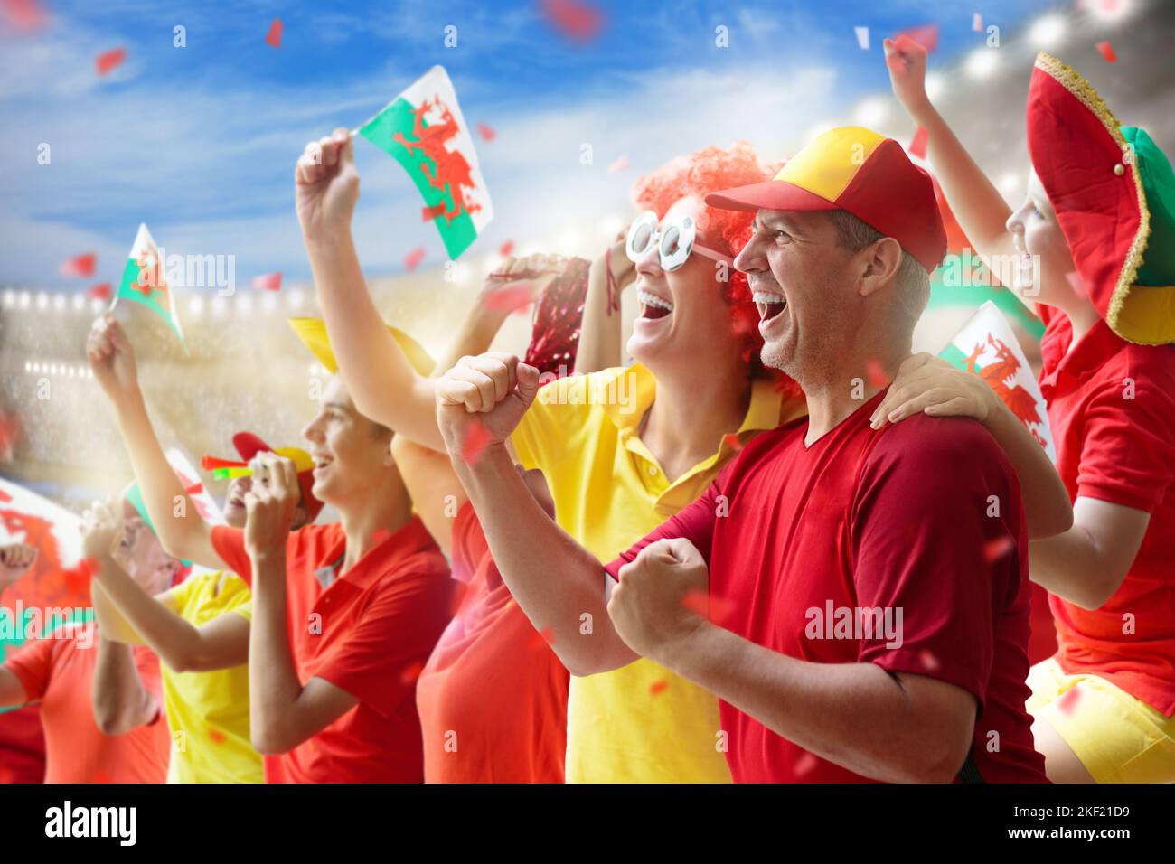 Wales fans on stadium. Welsh supporters. Crowd cheering for Wales ...