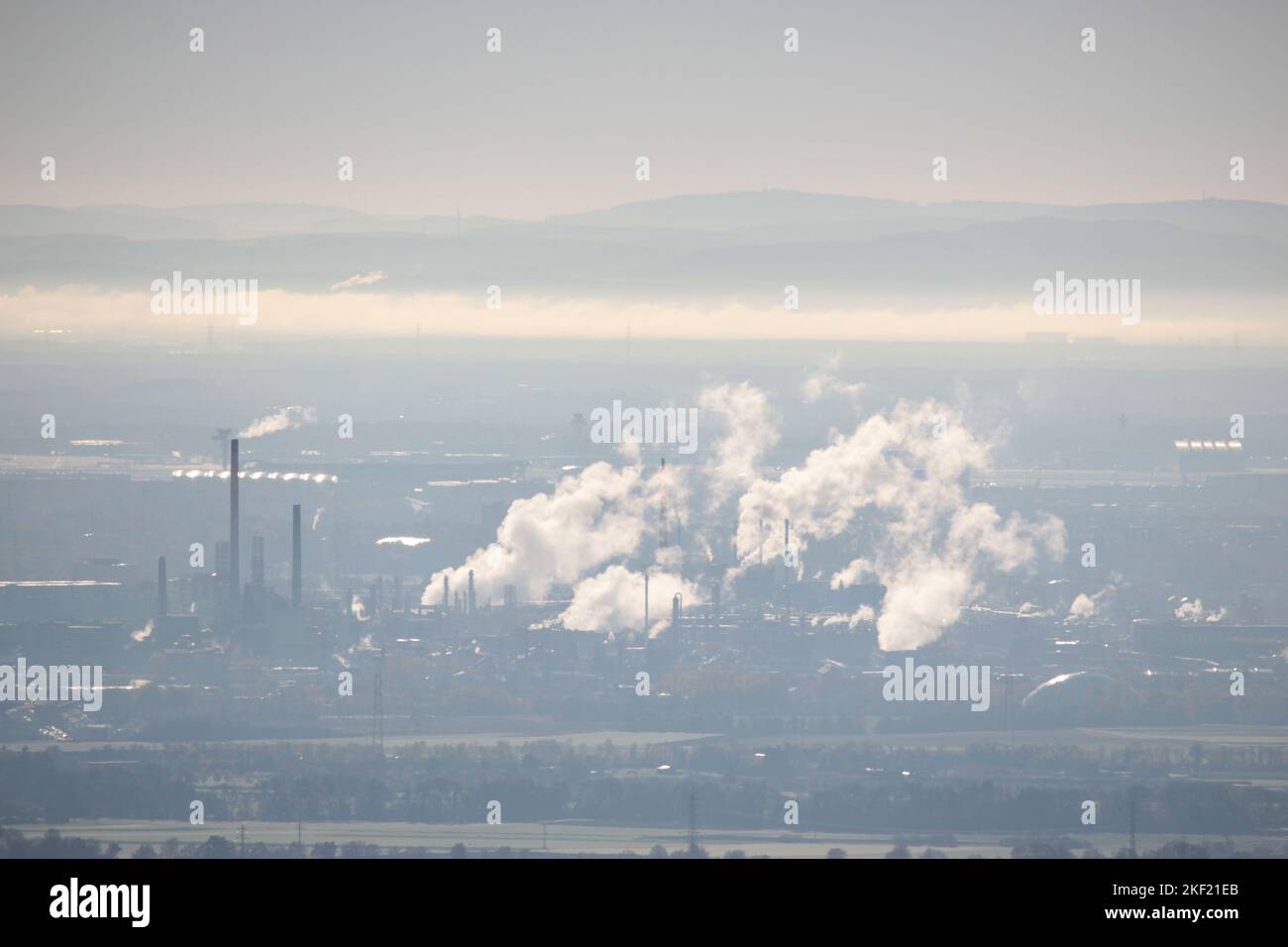 A view of a factory and industrial zone through the fog and smog, the ...