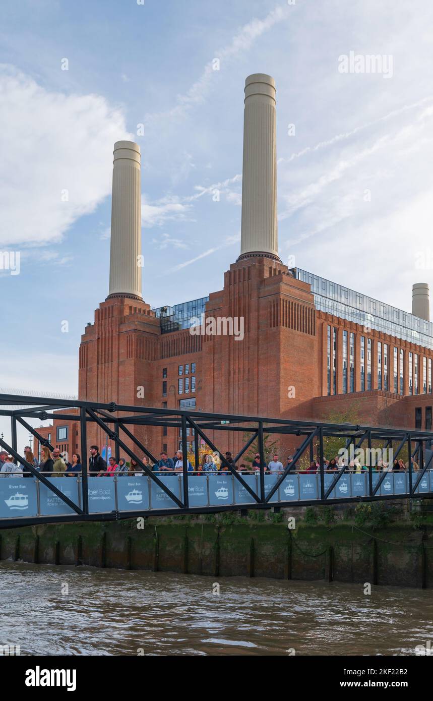 Crowd of people visiting iconic London landmark Battersea Power Station ...