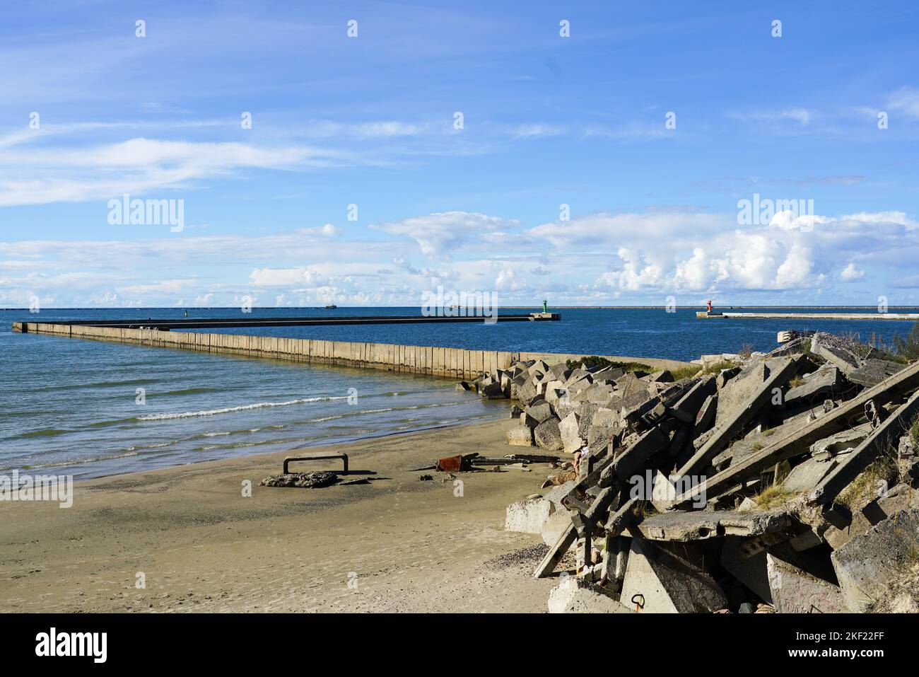 Harbor concrete breakwater system with entrance gates equipped with red ...