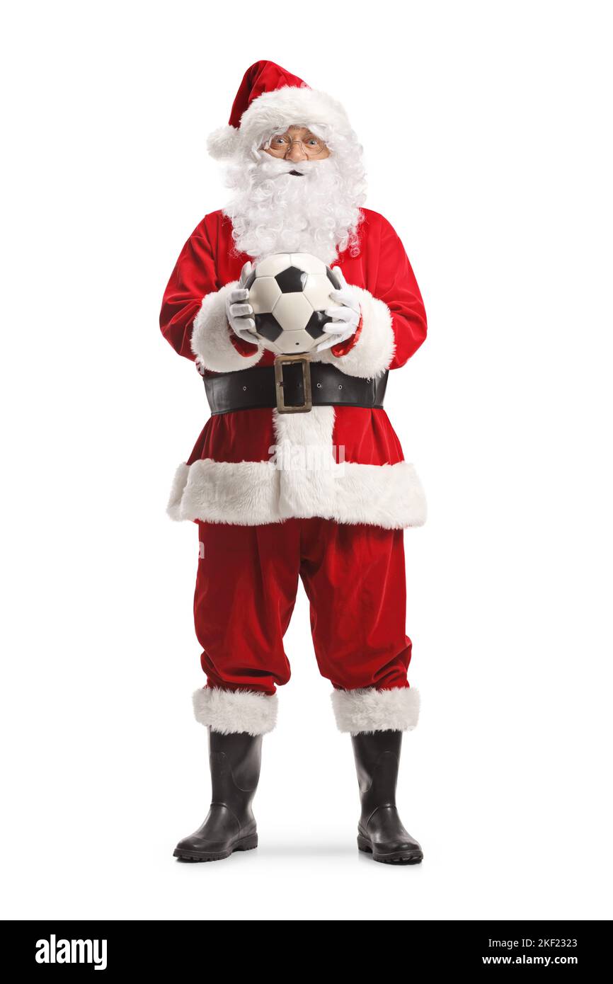 Full length portrait of Santa claus standing and holding a football ...