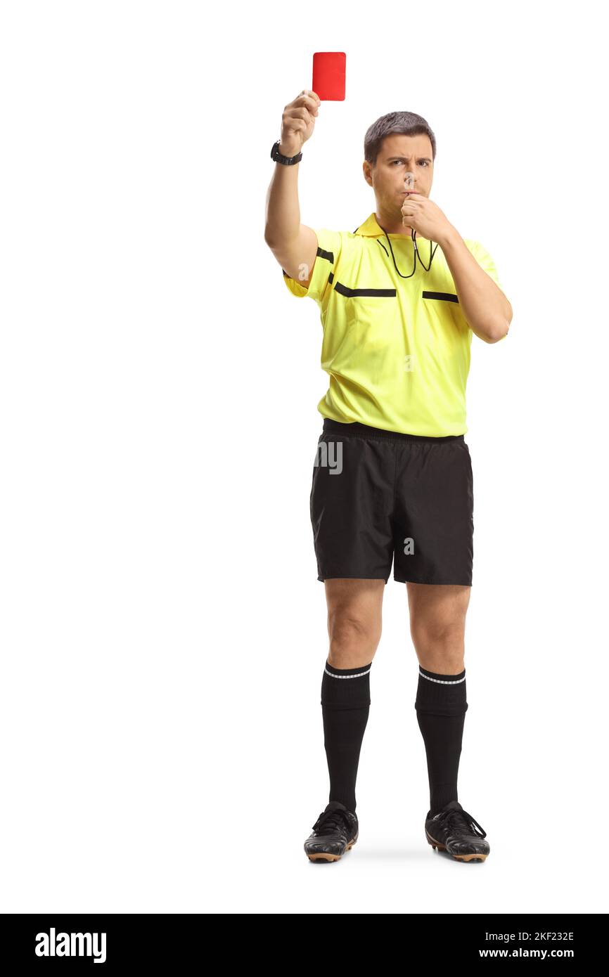 Full length portrait of a football referee blowing a whistle and ...