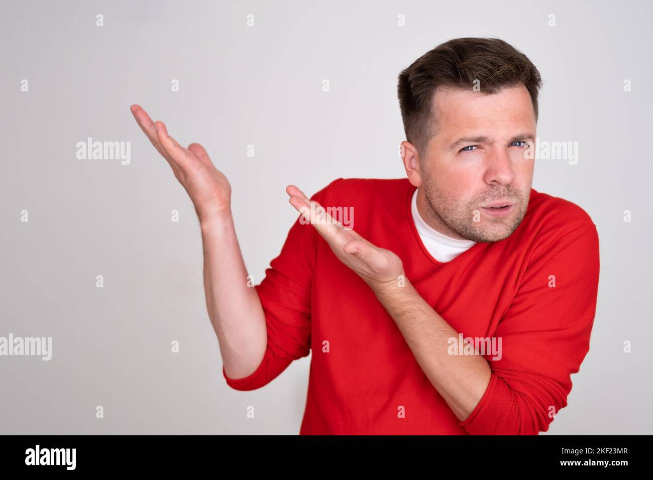 Young man points finger something hi-res stock photography and images ...