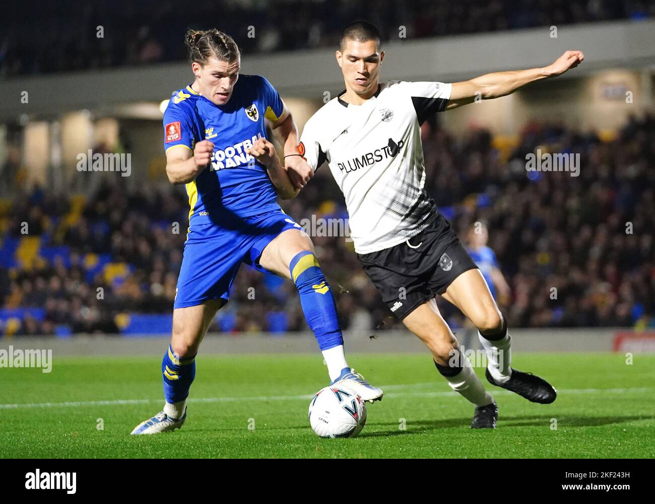 AFC Wimbledon's Joshua Davison (left) and Weymouth's Daniel Matsuzaka ...
