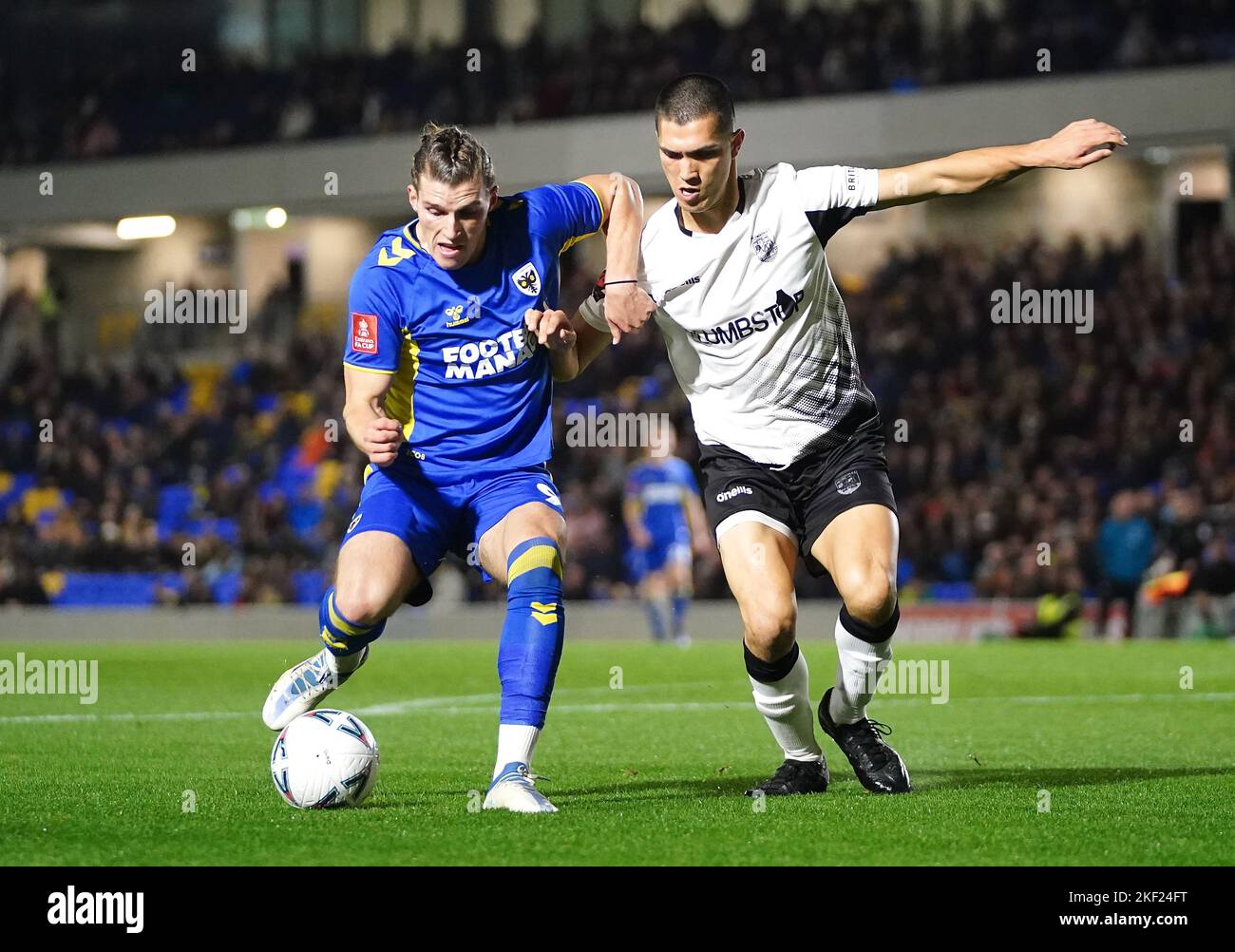 AFC Wimbledon's Joshua Davison (left) and Weymouth's Daniel Matsuzaka ...