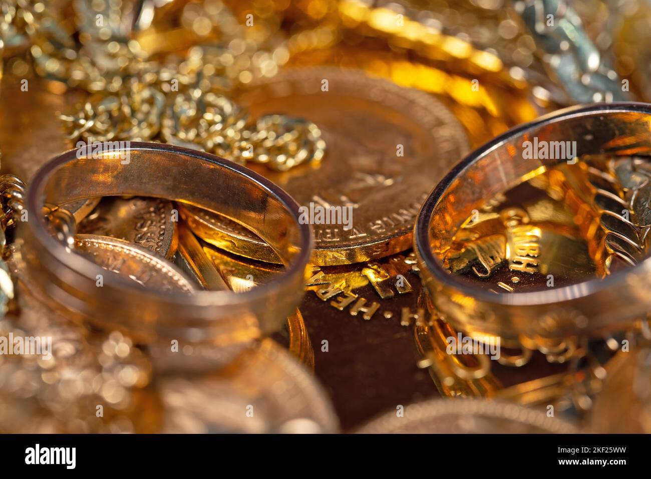 Gold jewelry, gold coins and gold bars in a close-up Stock Photo - Alamy