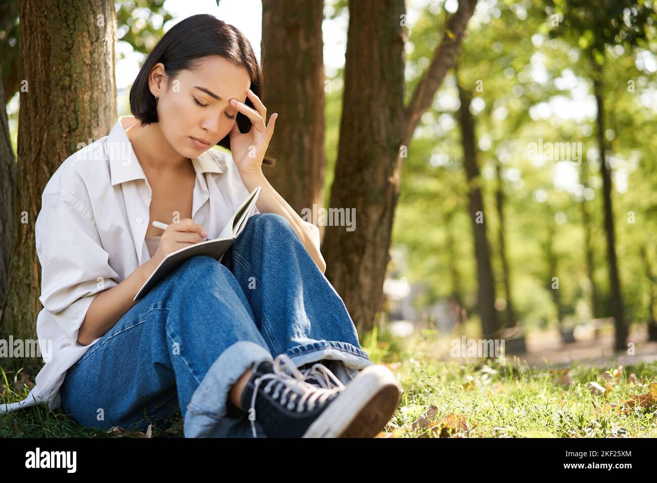 Sad Girl Writing In Diary