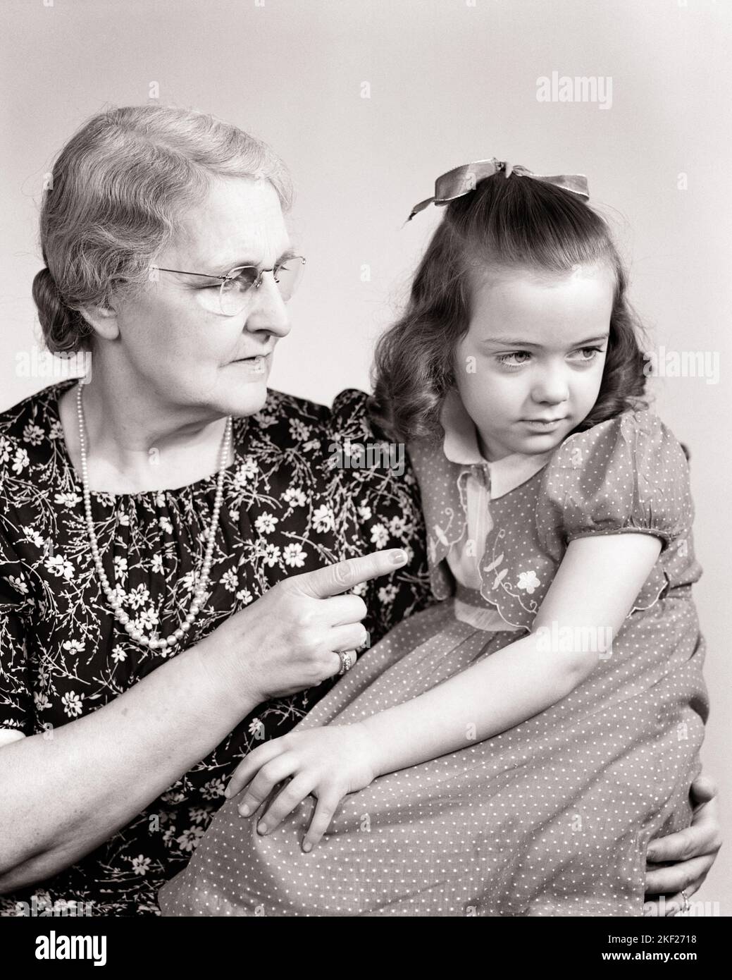 1940s WOMAN GRANDMOTHER POINTING FINGER SCOLDING A MISBEHAVING LITTLE ...