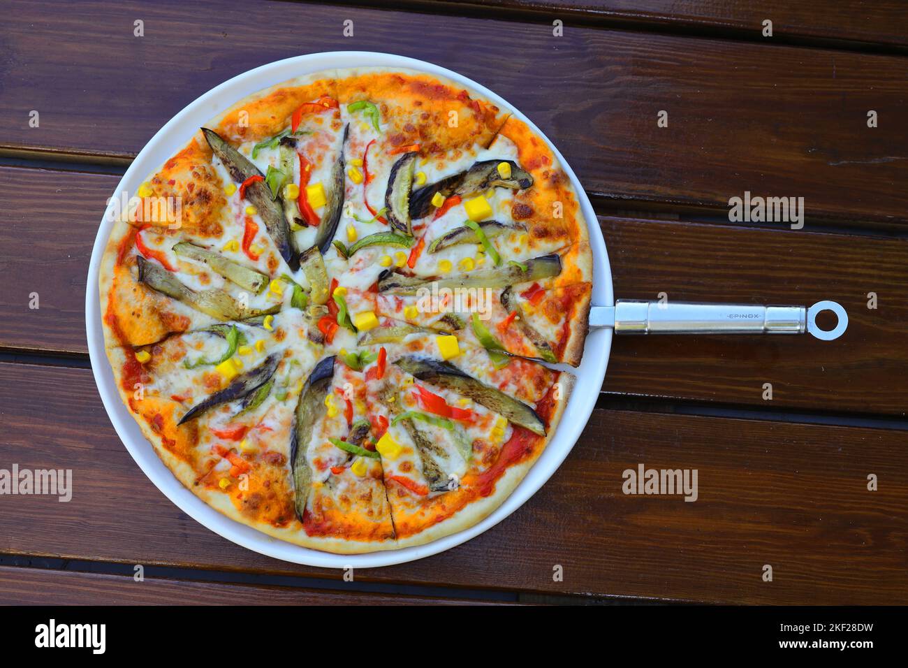 assorted pizza with different fillings: salami, tomatoes, mushrooms ...