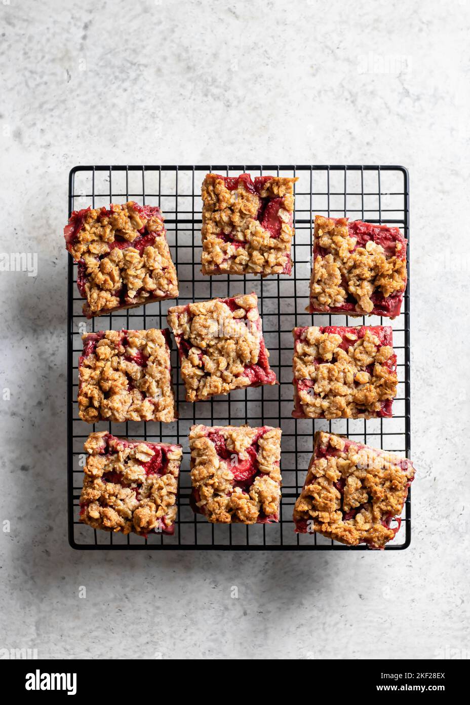 Crumble oatmeal strawberry bars on the baking cooling rack top view ...