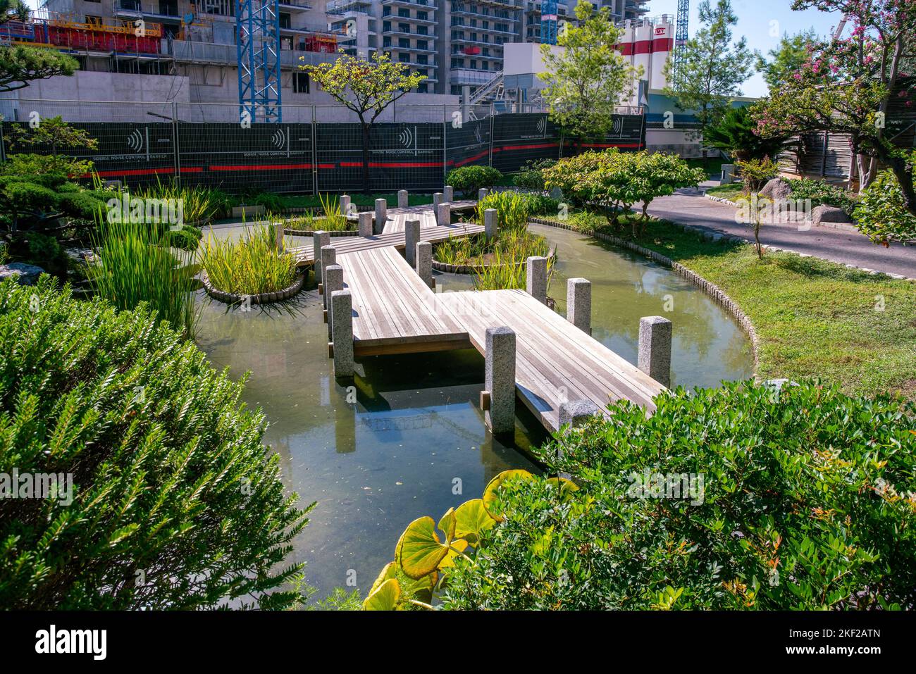Gorgeous view in Japanese garden in Monaco with pond and wooden zigzag ...