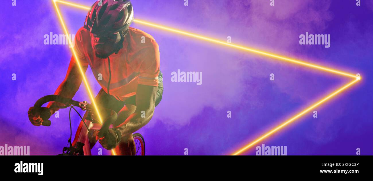 African american male cyclist riding bicycle with illuminated triangle ...