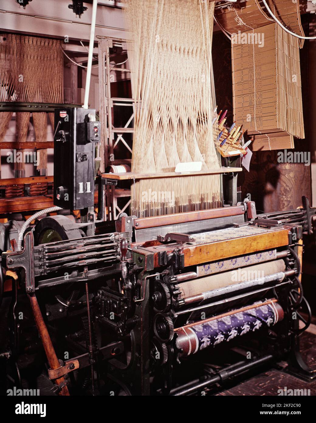 1960s 1970s WEAVING MACHINE CREATING A PATTERNED BLUE AND WHITE FABRIC ...